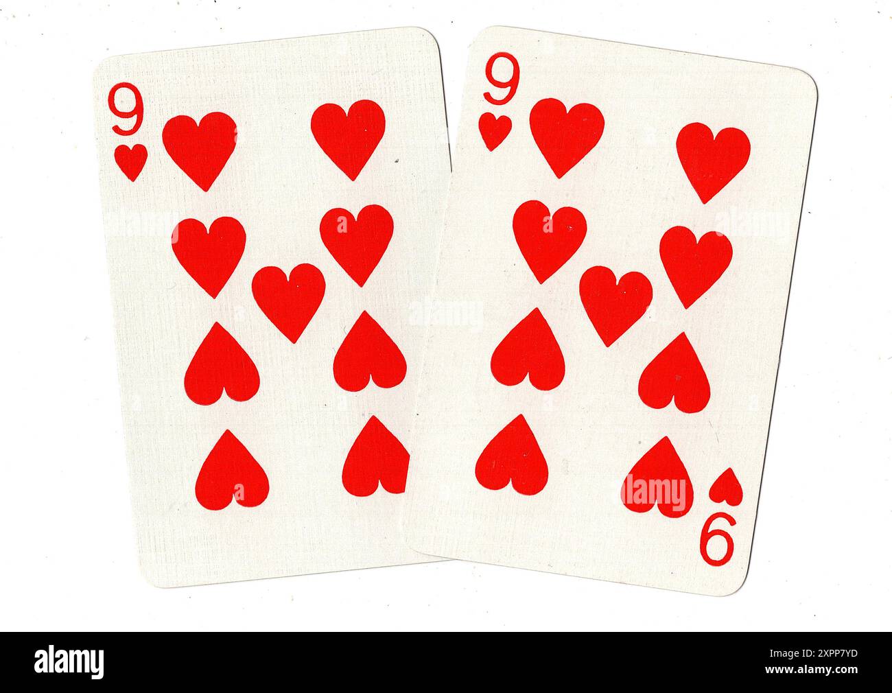 A pair of vintage nine of hearts playing cards on a white background ...