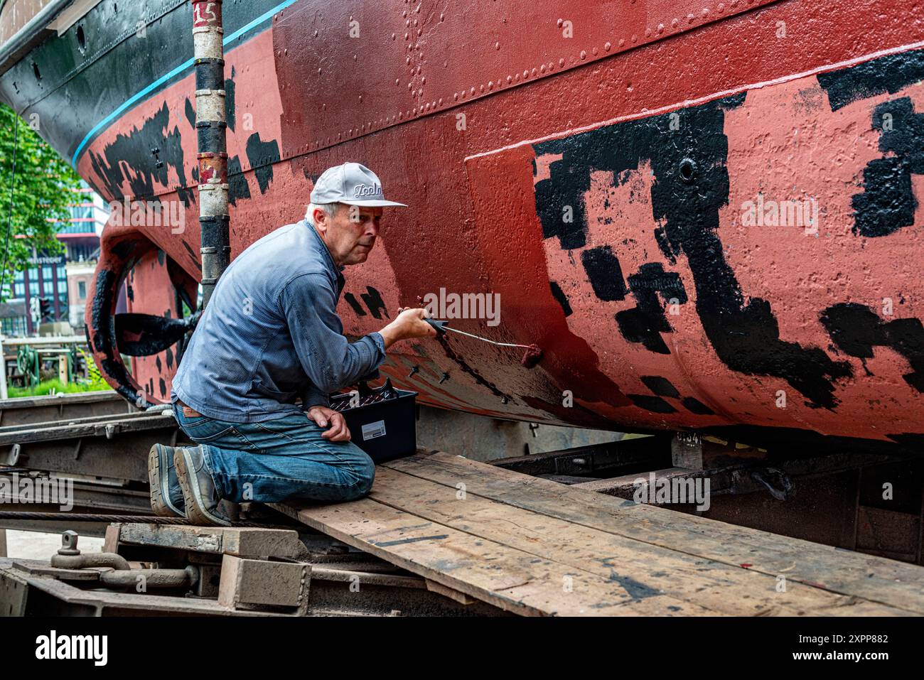 Crraftsman Painting Vessel Craftsman Painting the Hull of a Historical ...