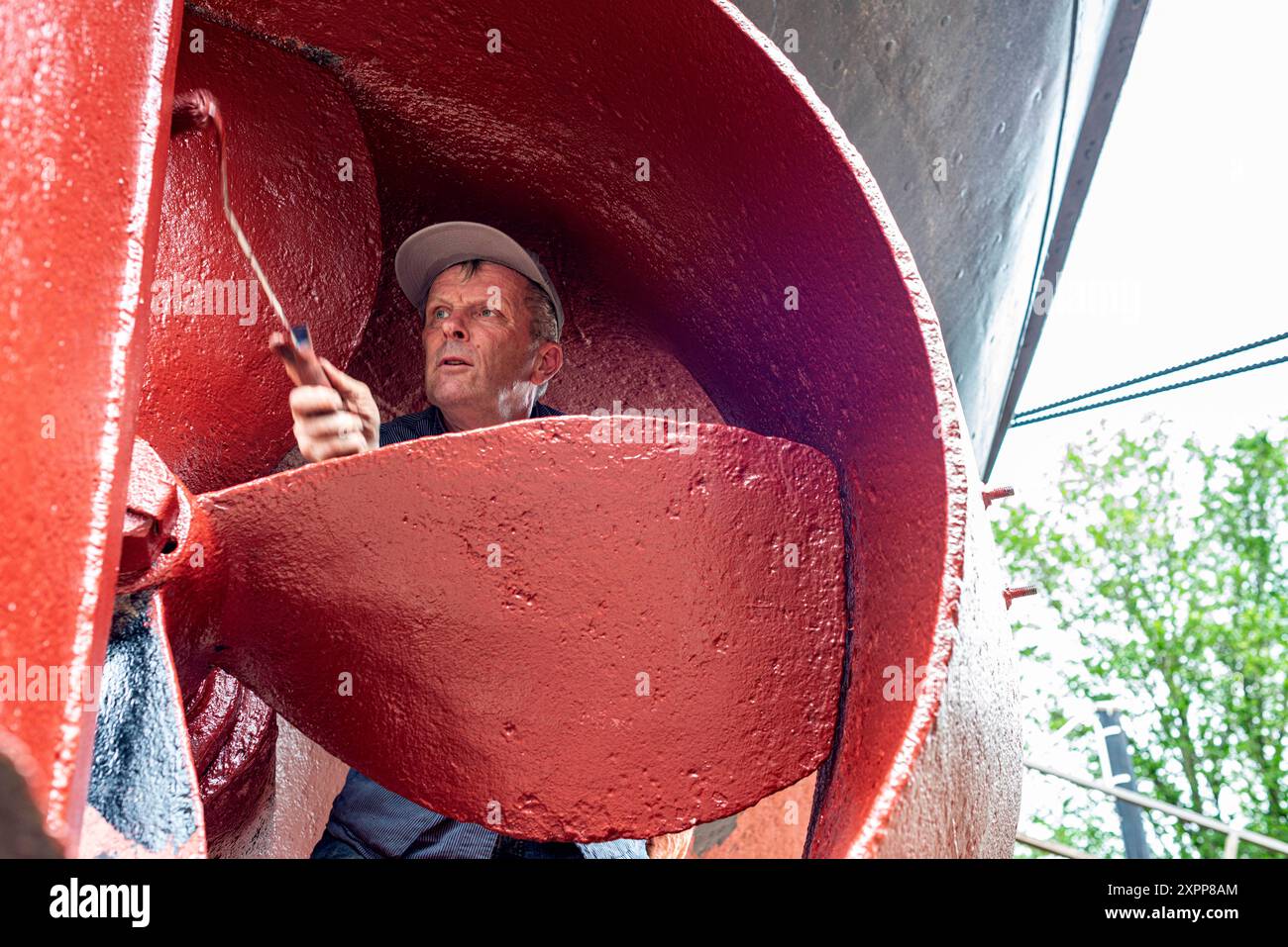 Crraftsman Painting Vessel Craftsman Painting the Hull and Propeller of ...