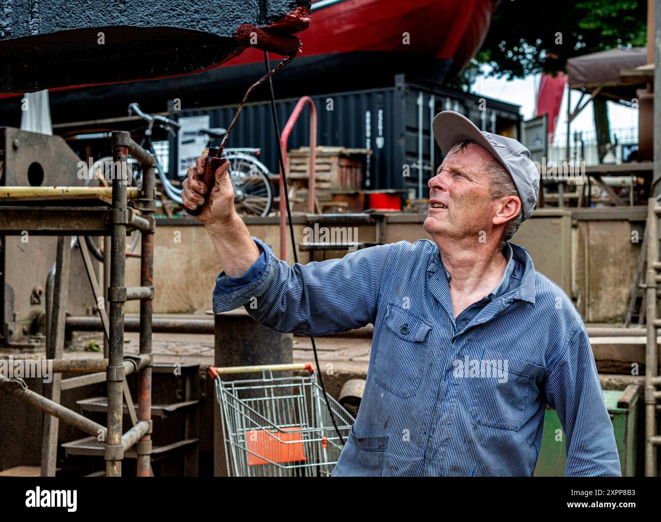 Crraftsman Painting Vessel Craftsman Painting the Hull of a Historical ...