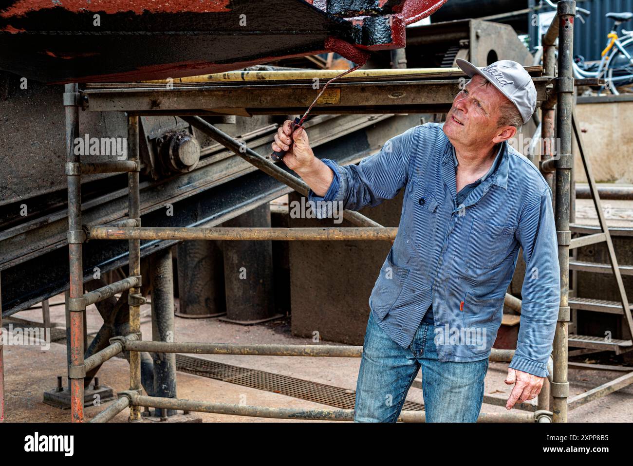 Crraftsman Painting Vessel Craftsman Painting the Hull of a Historical ...