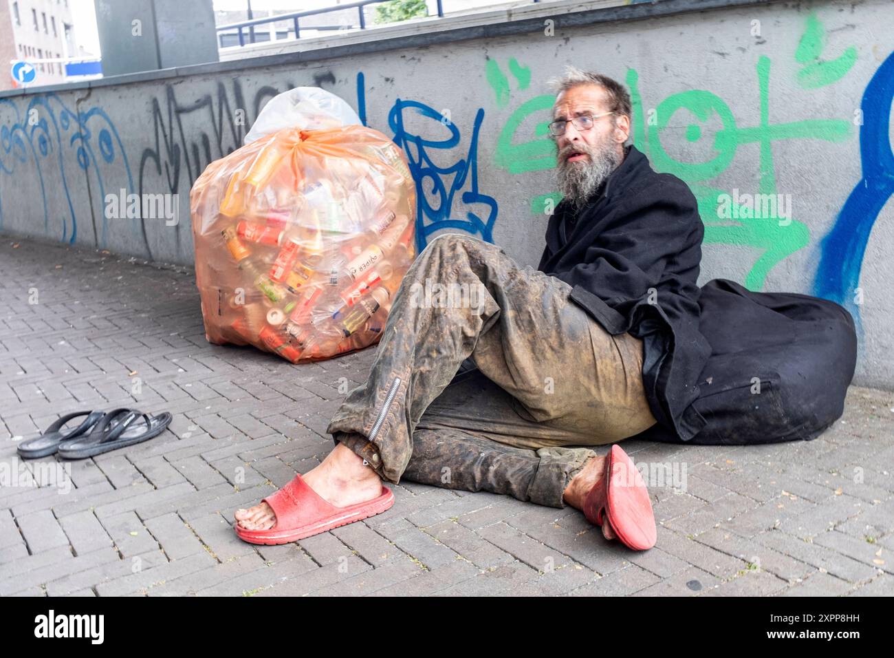 Homeless man taking plastic bottle hi-res stock photography and images ...