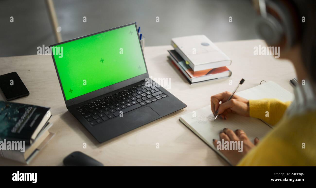 Over the Shoulder Shot with a College Student Studying in a Public ...