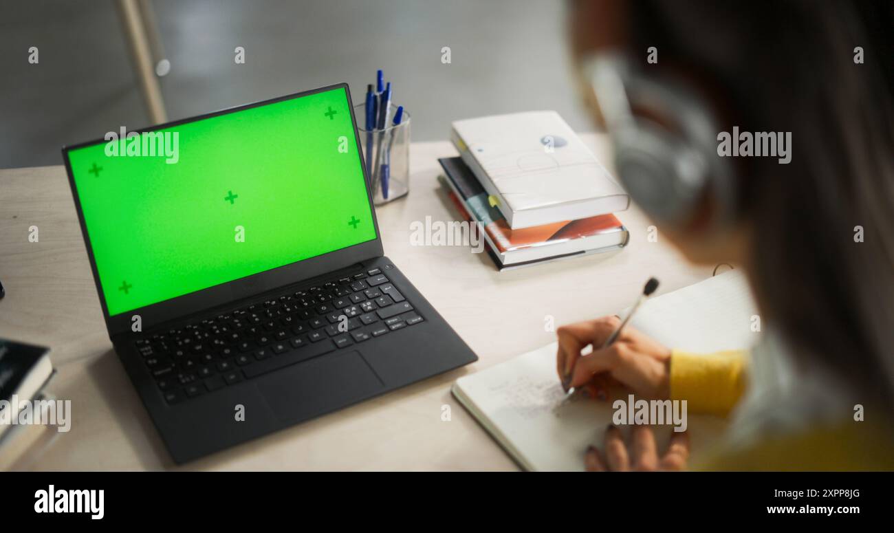 Over the Shoulder Shot with a College Student Studying in a Public ...