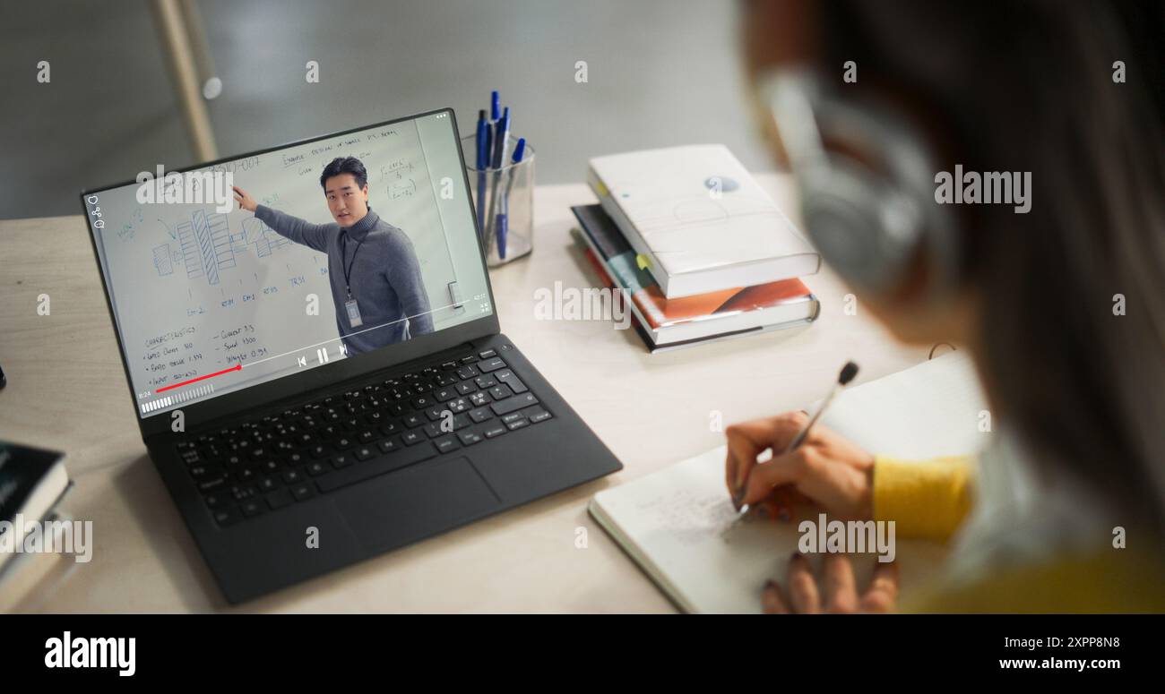 Over the Shoulder Shot with a College Student Studying Engineering in a ...