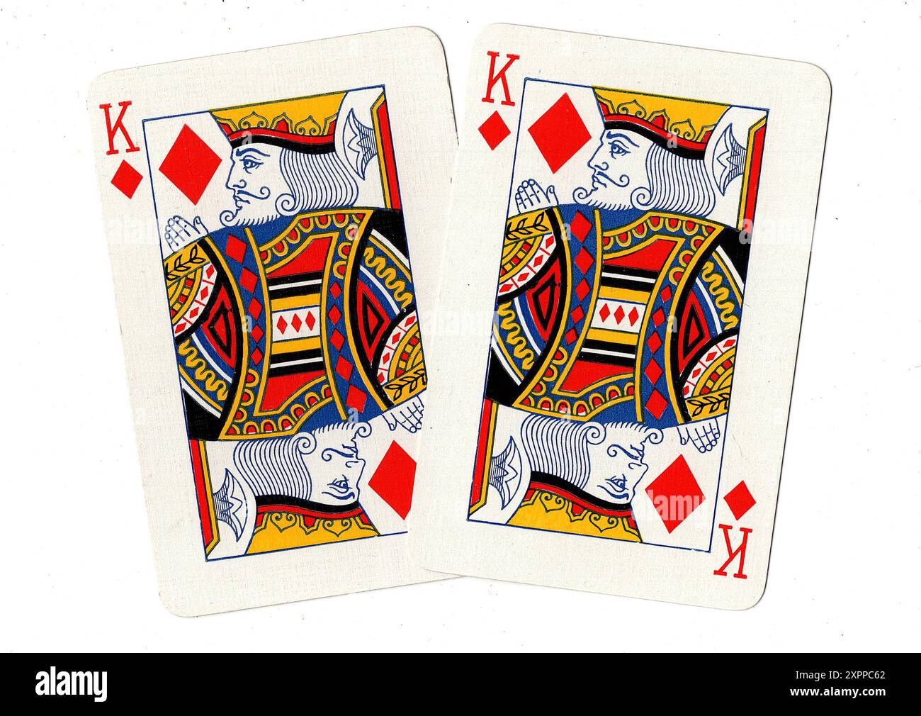 A pair of vintage king of diamonds playing cards on a white background ...