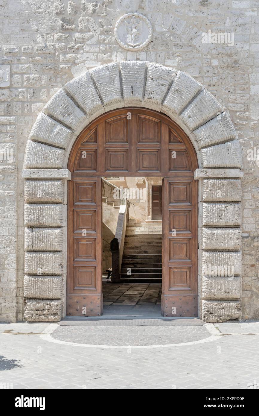 cityscape with monumental travertine portal of historical Priori Palace ...