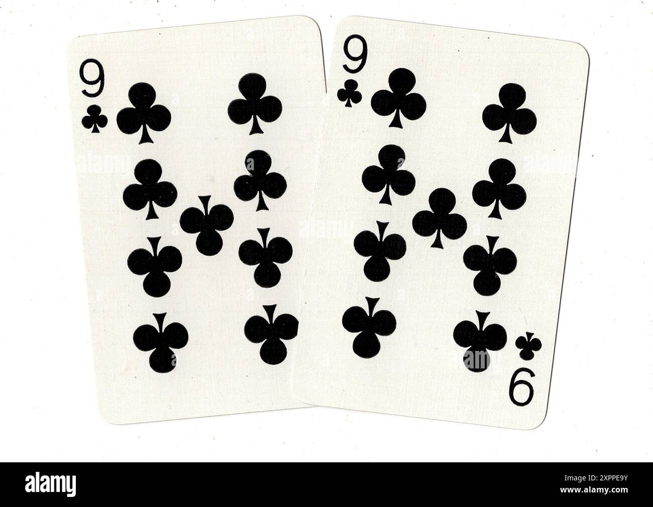 A pair of vintage nine of clubs playing cards on a white background ...