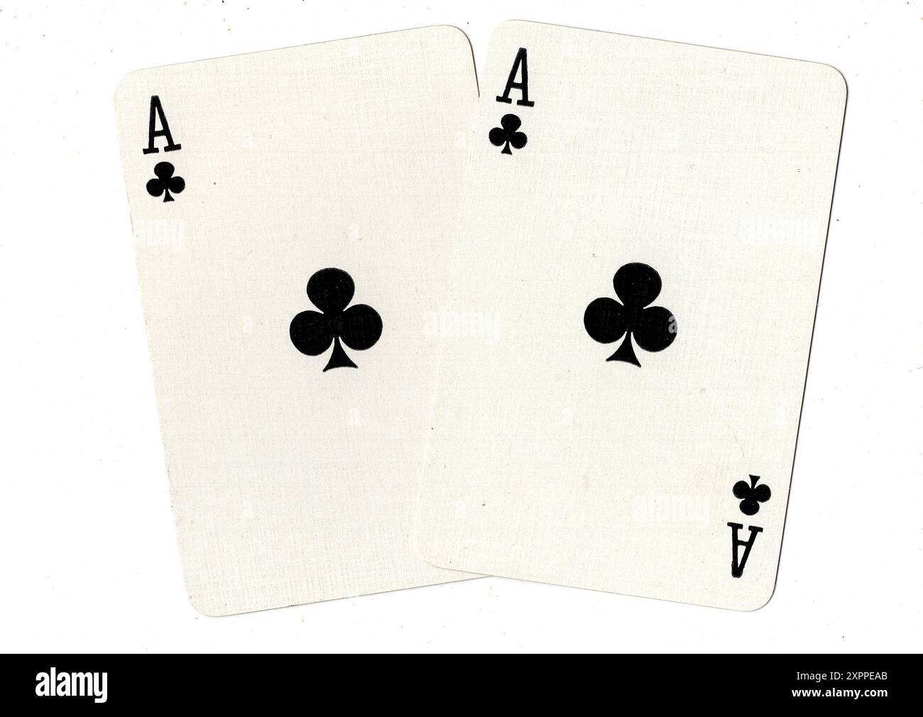 A pair of vintage ace of clubs playing cards on a white background ...