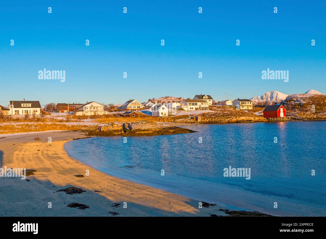 Traditional red and yellow wooden norwegian cabins with ground on the ...