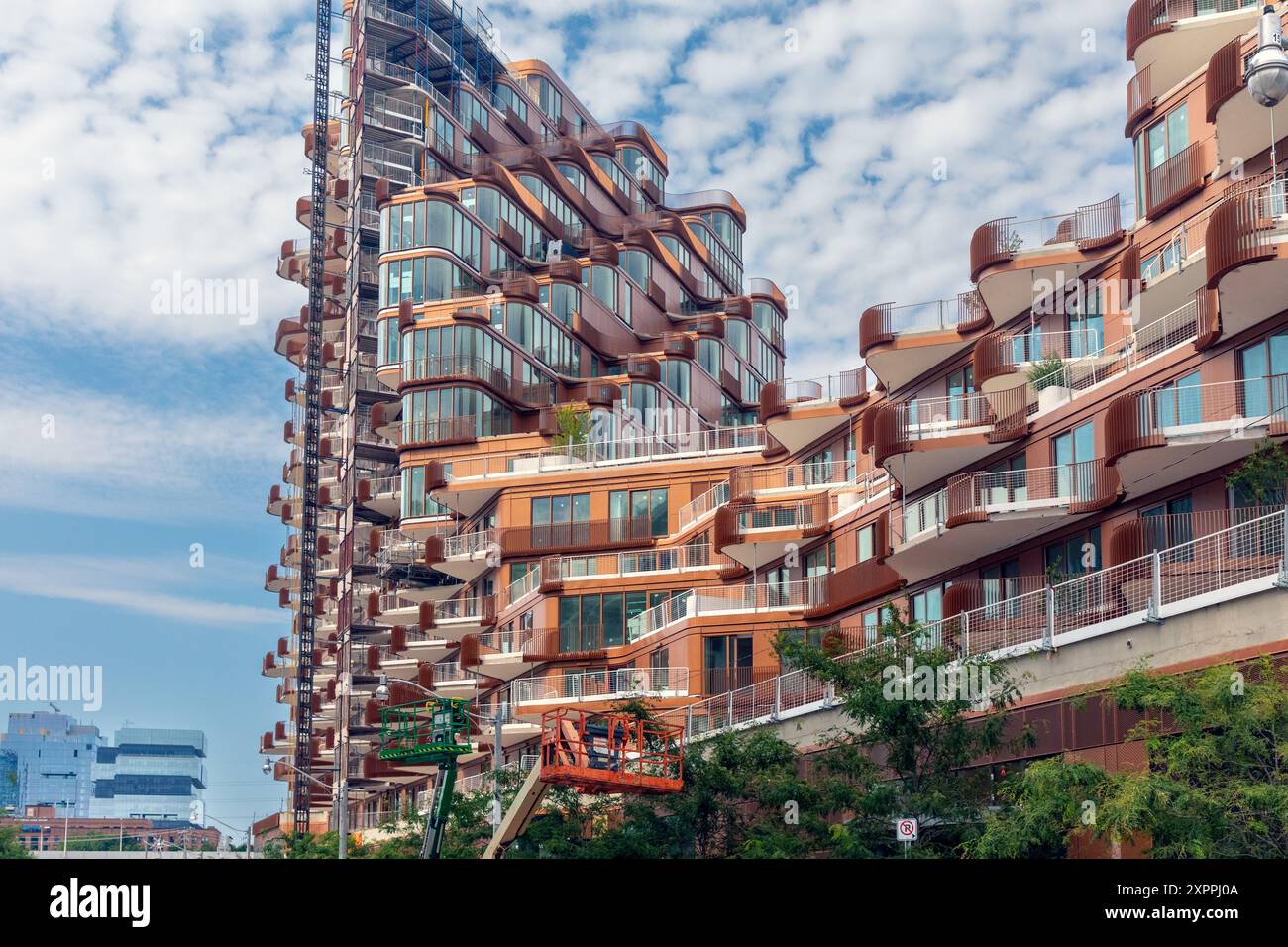 A curvaceous, colourful condo under construction. A stark contrast to ...