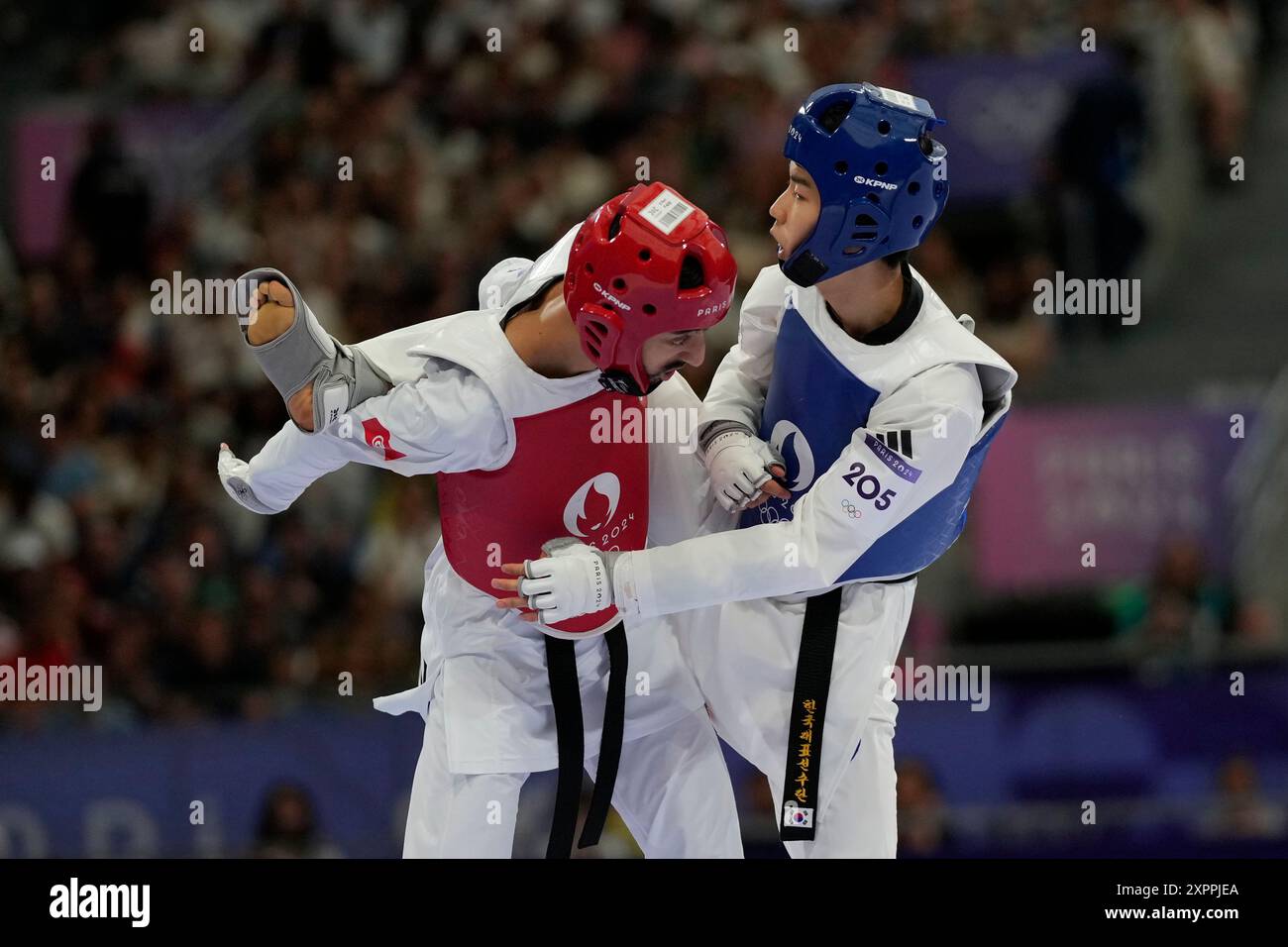 Korea's Taejoon Park competes with Tunisia's Mohamed Khalil Jendoubi in ...