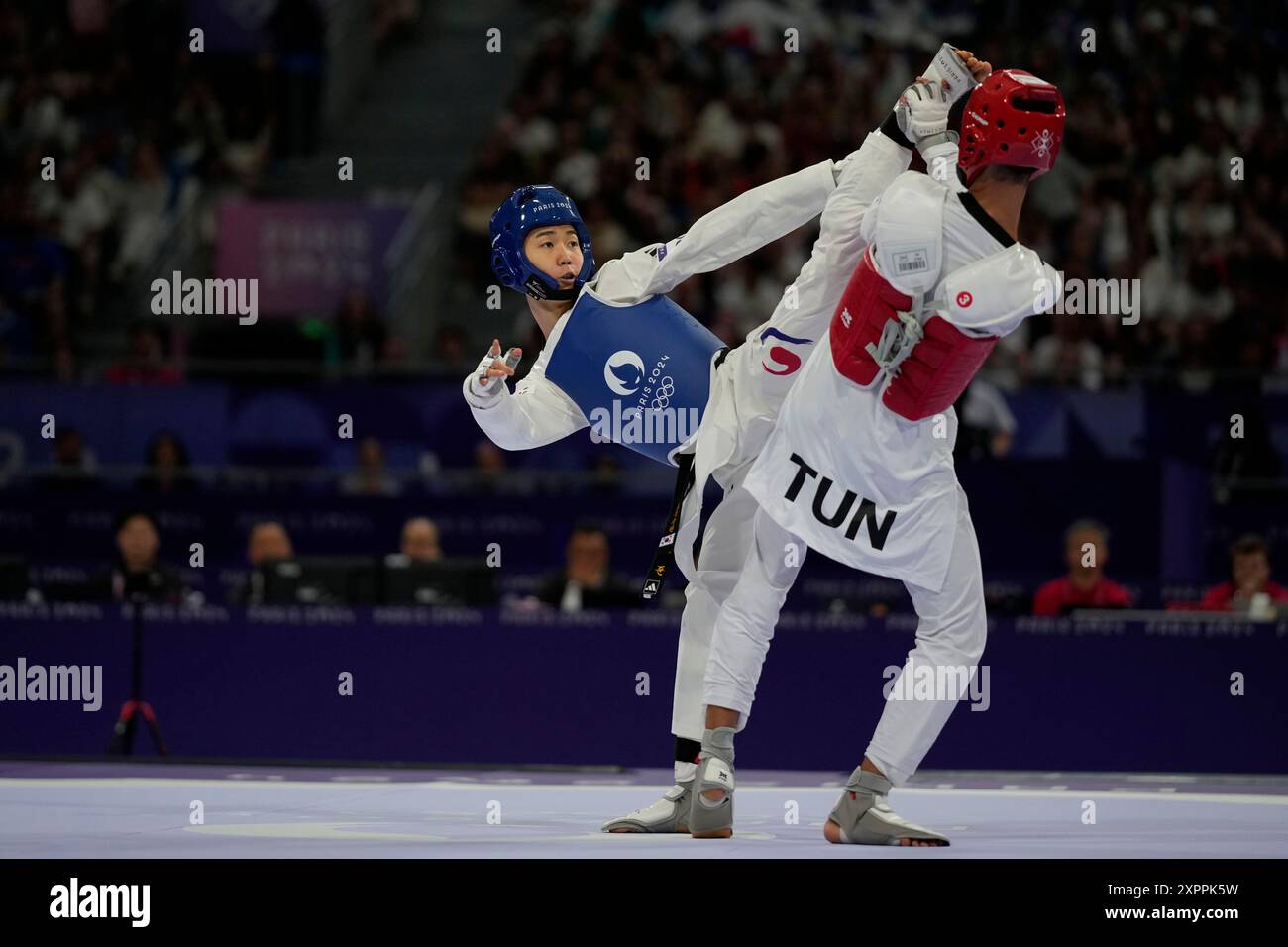 Korea's Taejoon Park competes with Tunisia's Mohamed Khalil Jendoubi in ...