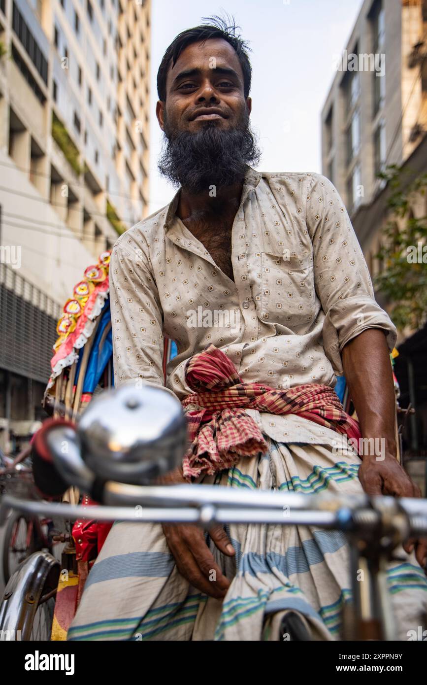Portrait of a cycle rickshaw driver in downtown Dhaka, Dhaka ...