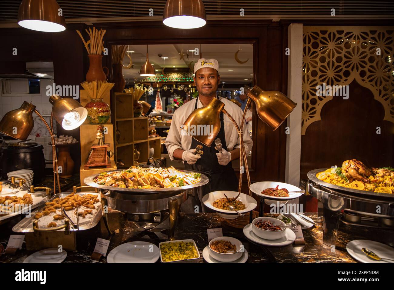 Chef serving food at delicious dinner buffet at Sarina Hotel, Dhaka ...