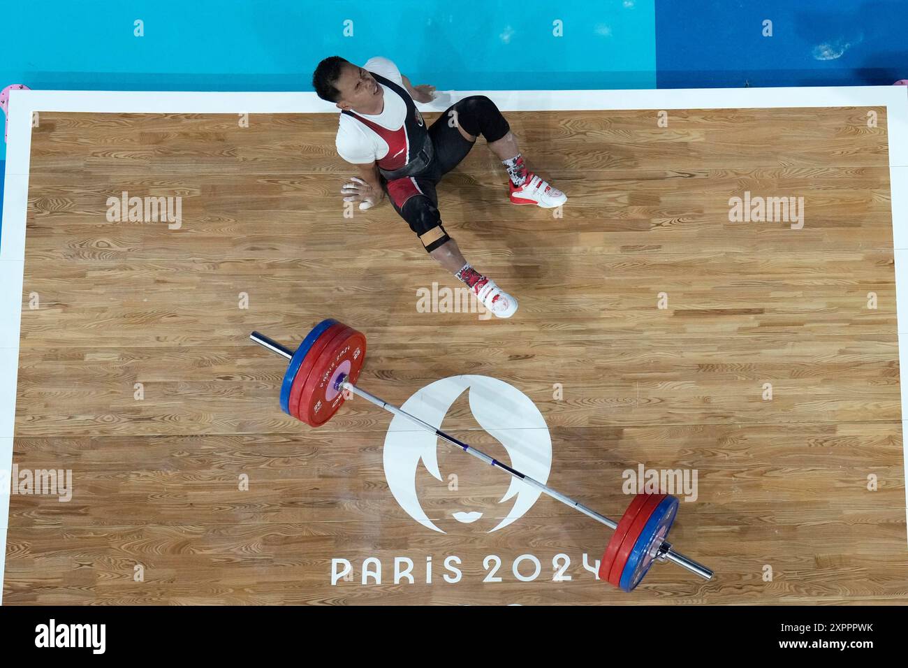 Eko Irawan of Indonesia reacts after failing to. lift during the men's ...