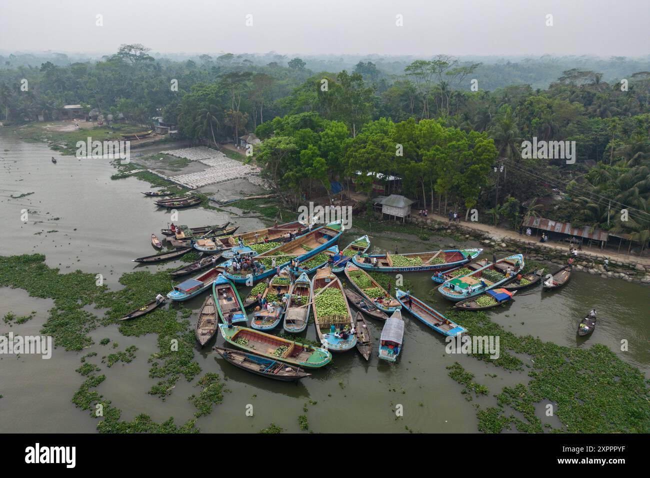Aerial view of traders selling watermelons and other fruits from boats ...