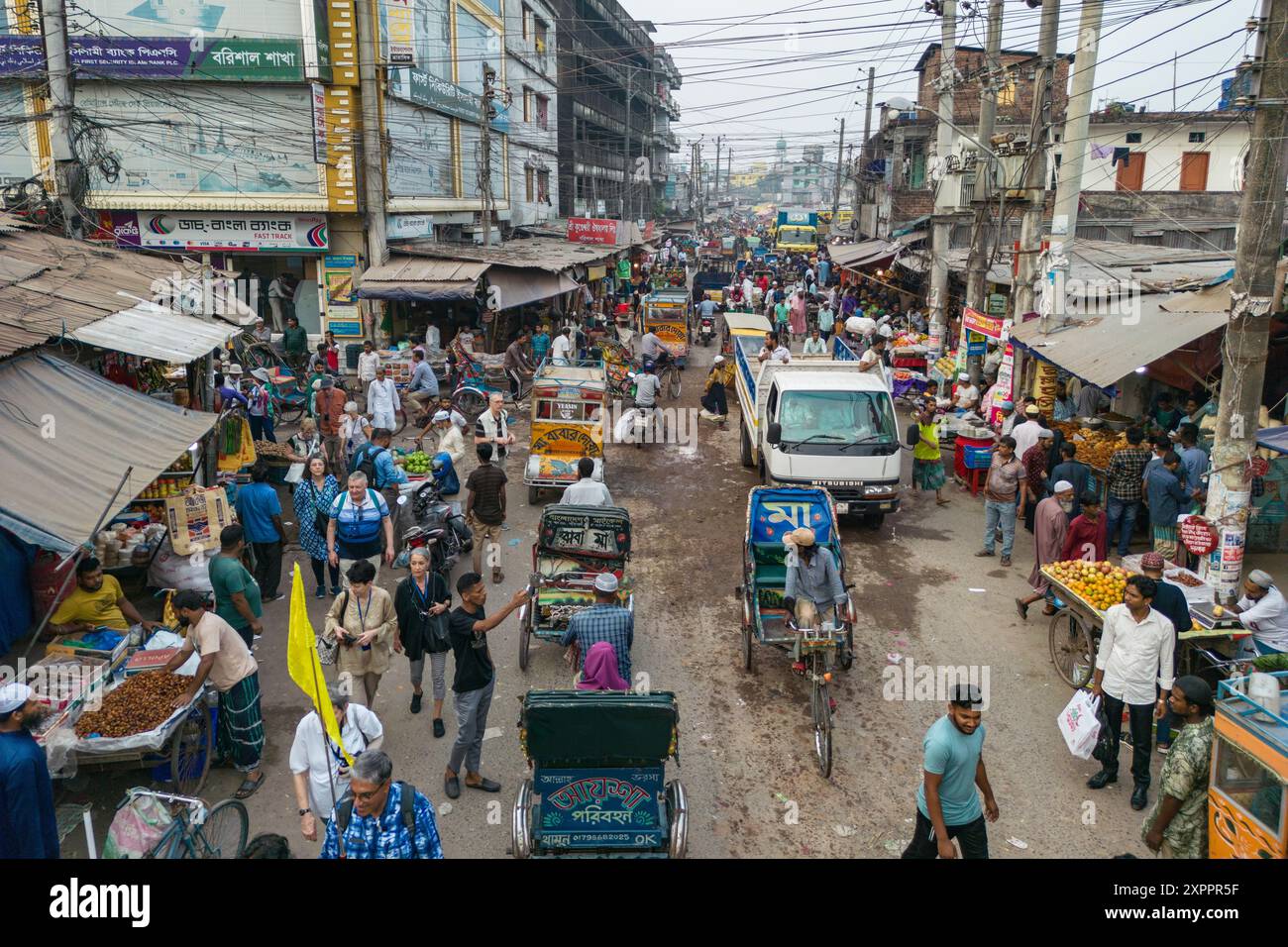 Aerial view of hustle and bustle on a downtown street, Barisal ...