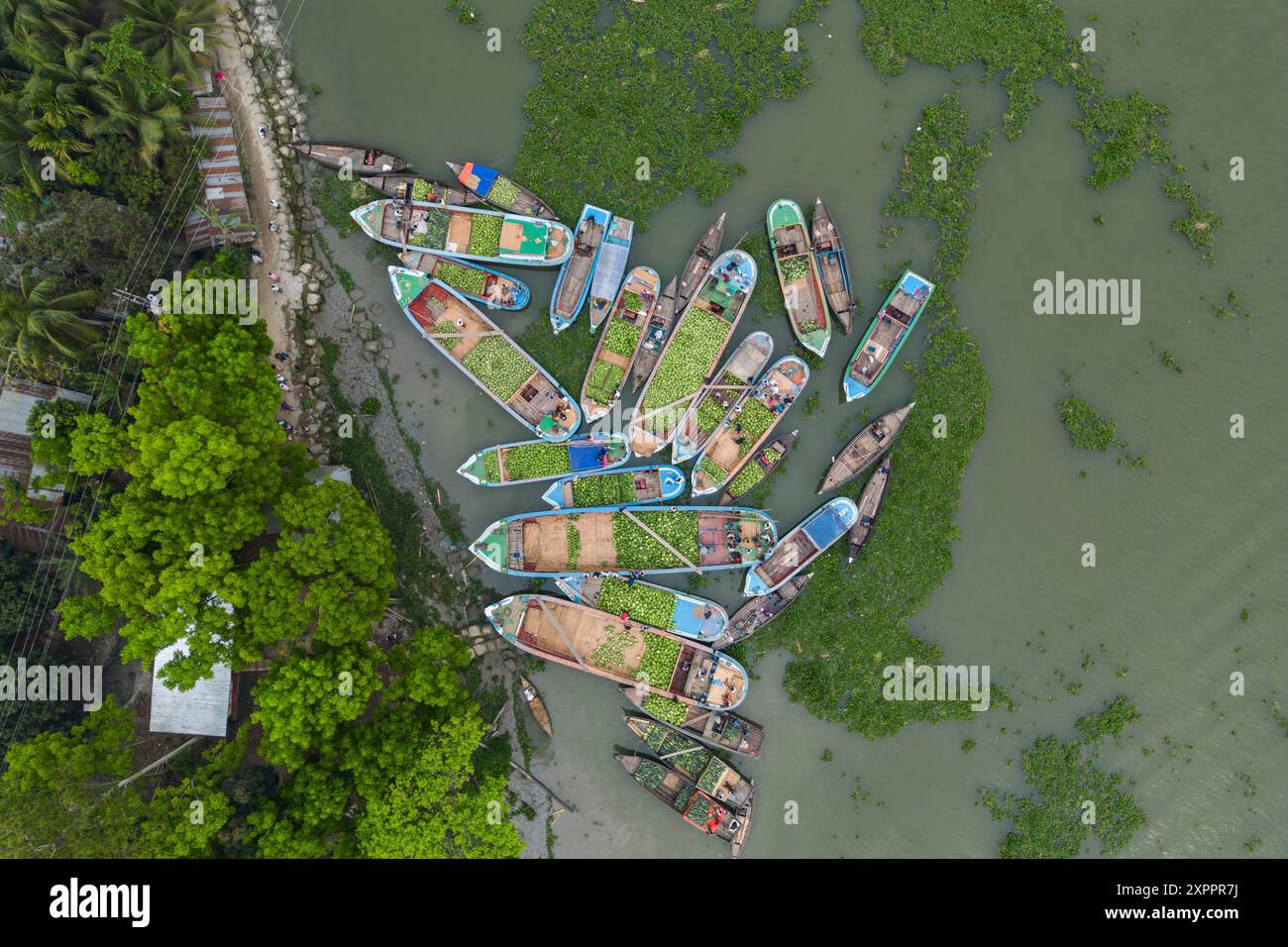 Aerial view of traders selling watermelons and other fruits from boats ...