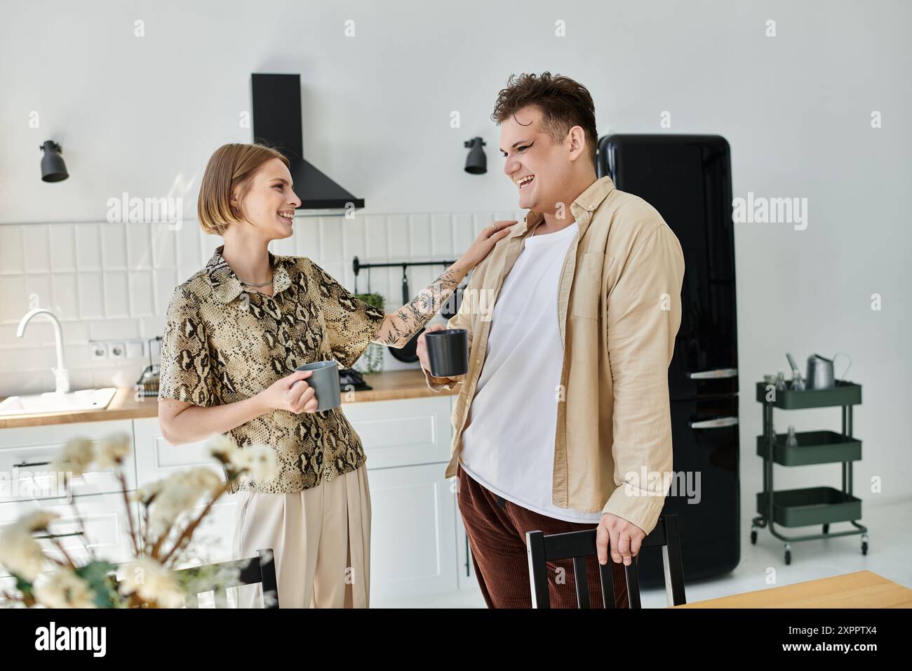 Joyful laughter fills the cozy kitchen as friends enjoy each other's ...