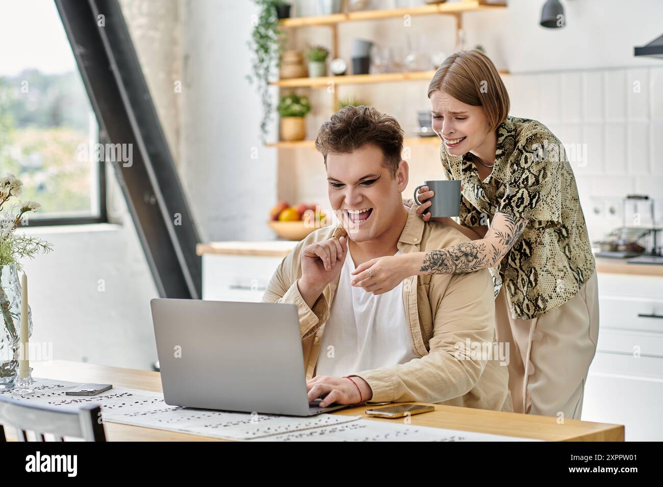 Joyful moments shared between friends at home with laughter and a cup ...