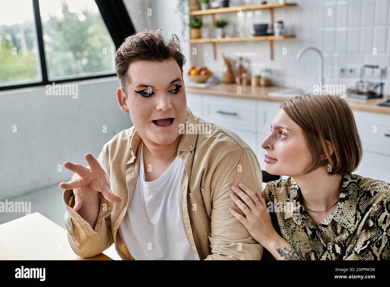 Two friends engage in lively conversation at home, filled with joy and ...