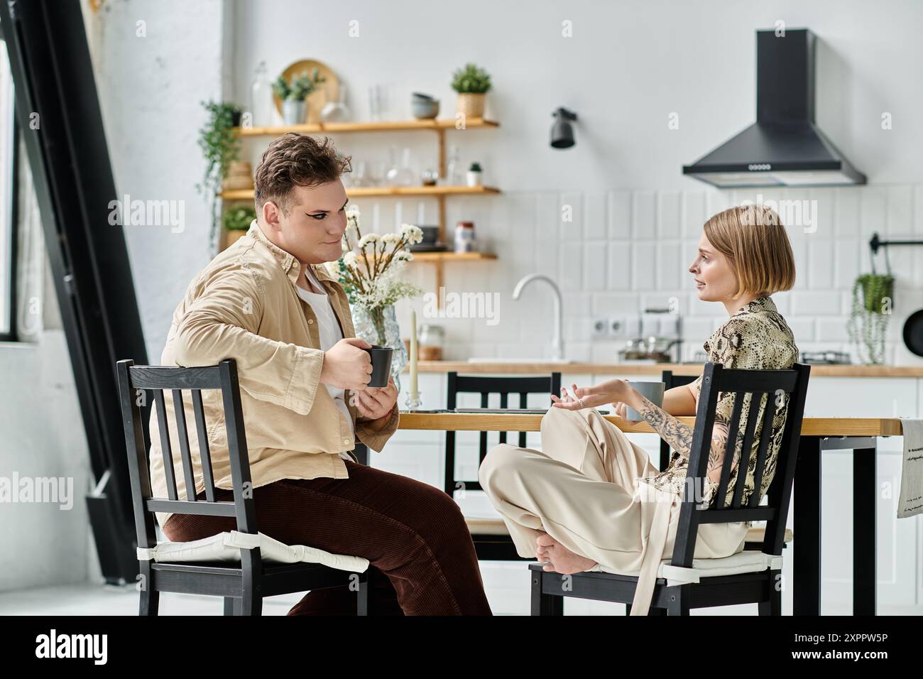 Two friends share a heartfelt conversation over coffee in a cozy ...