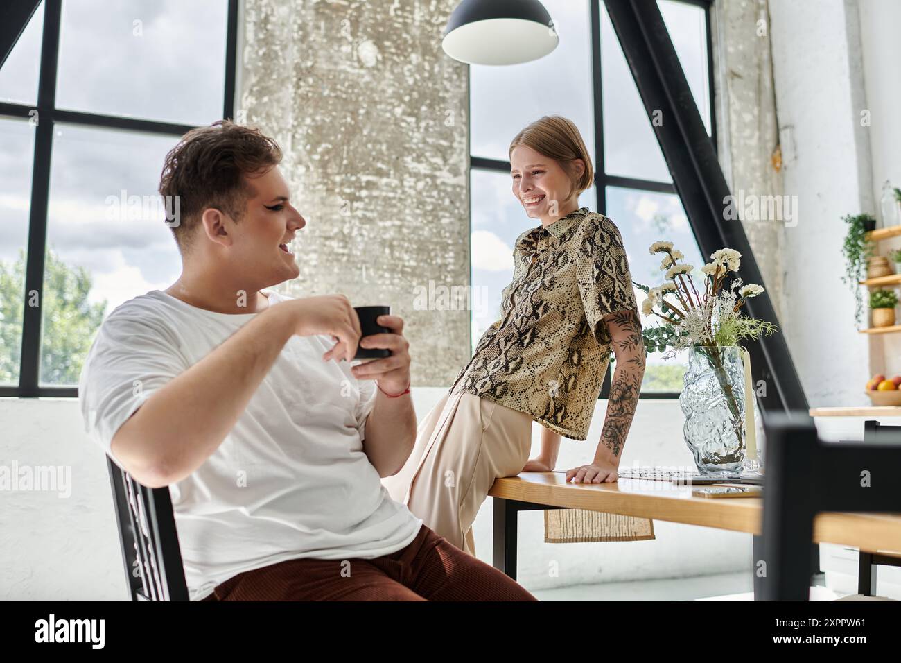 A joyful moment shared between two friends at home, showcasing their ...