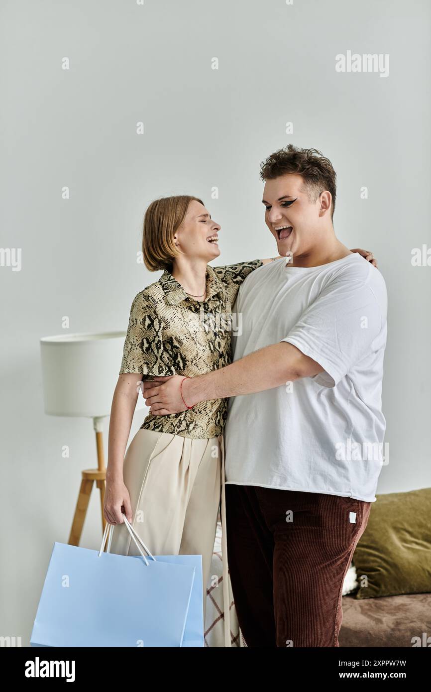 Two friends share laughter and joy while cuddling at home Stock Photo ...