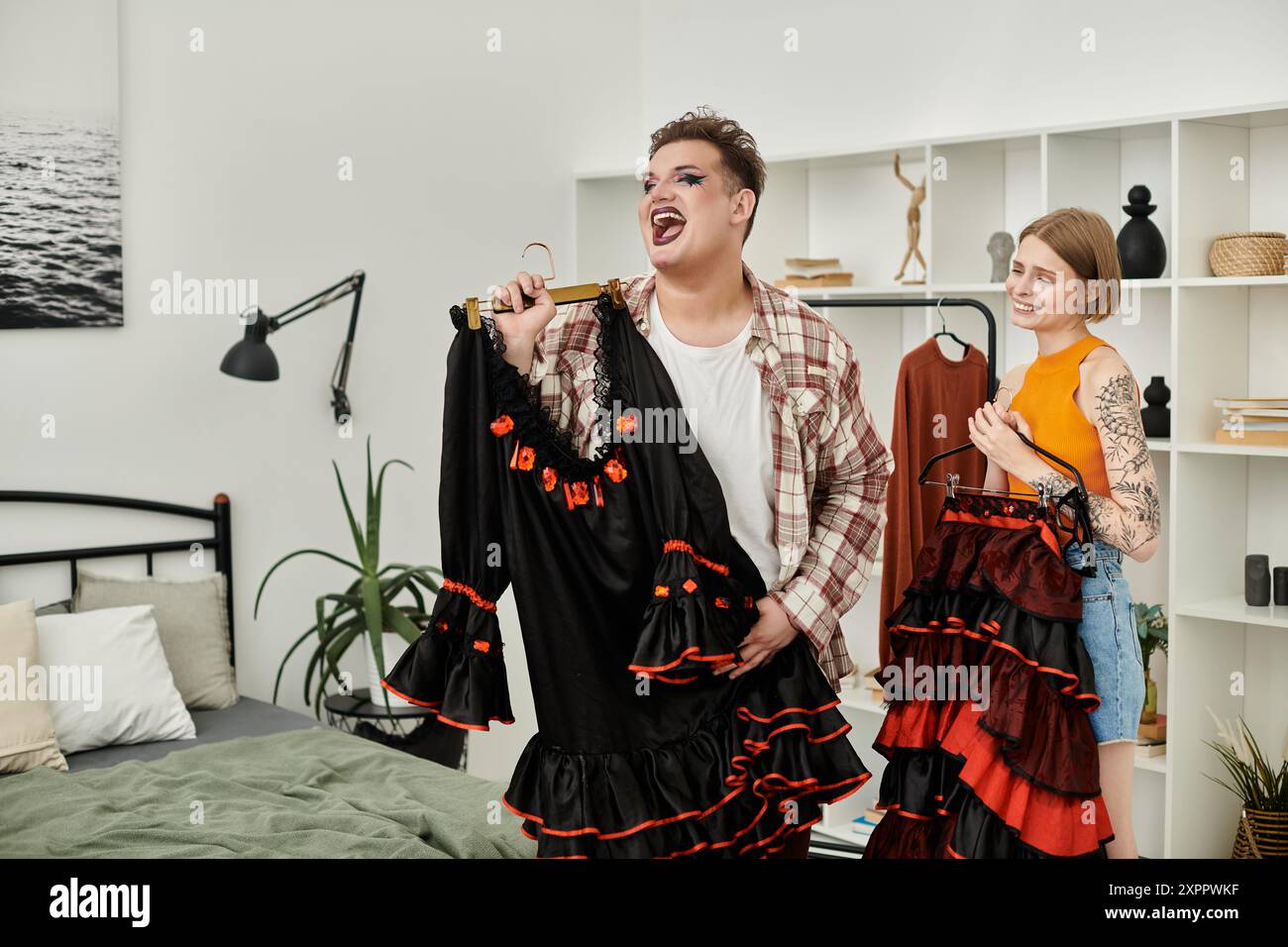 Two friends joyfully engage in a fashion moment at home, sharing ...