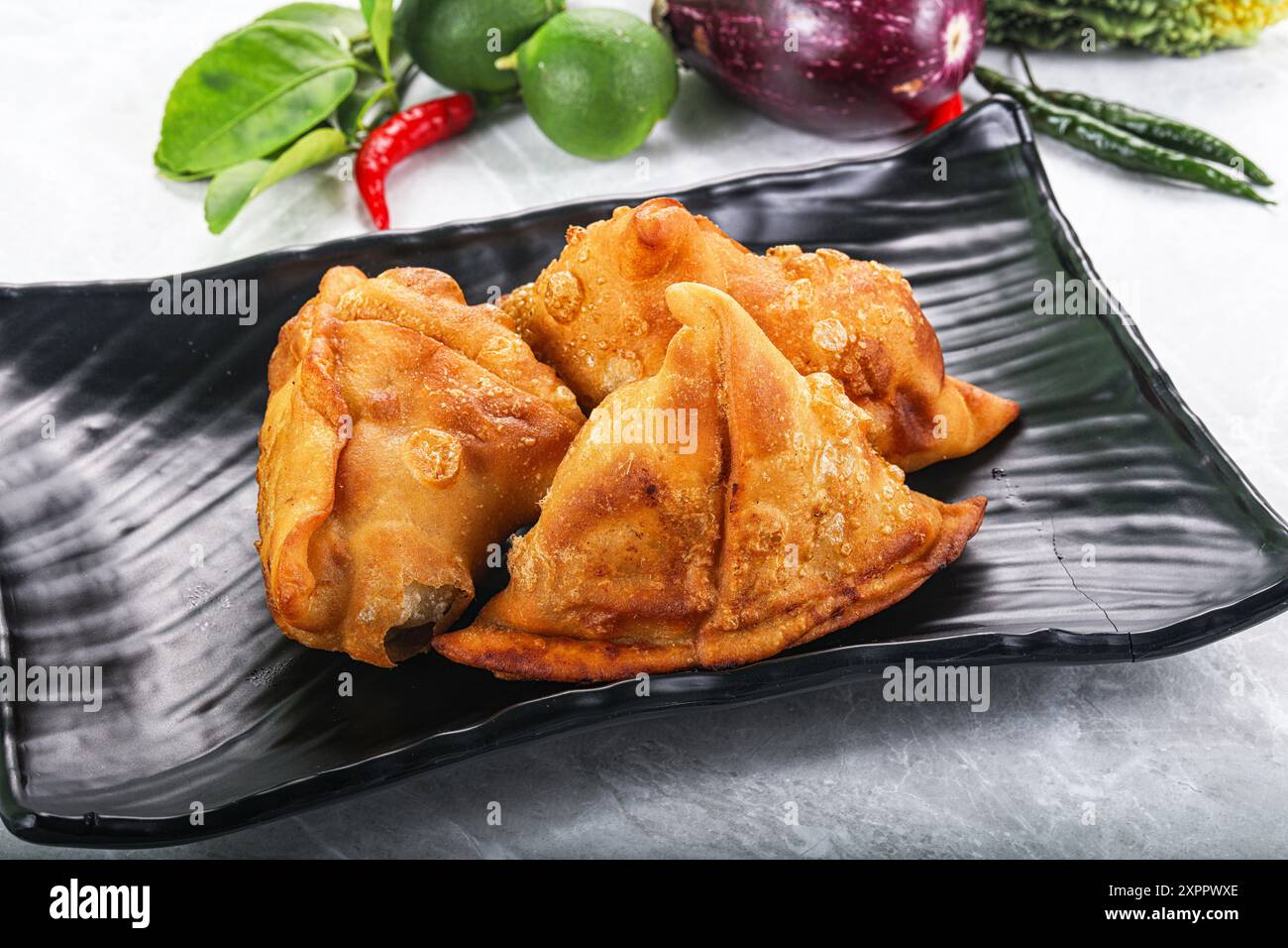 Indian cuisine - fries crispy stuffed samosa Stock Photo - Alamy