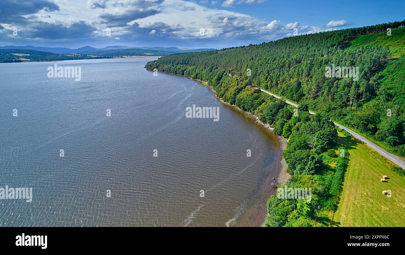 Dornoch Firth in summer looking down the shoreline to Bonar Bridge and ...