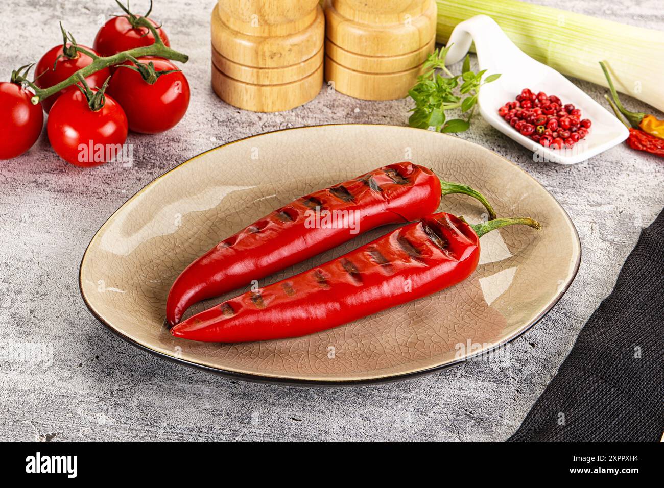 Grilled red spicy pepper snack in the bowl Stock Photo - Alamy