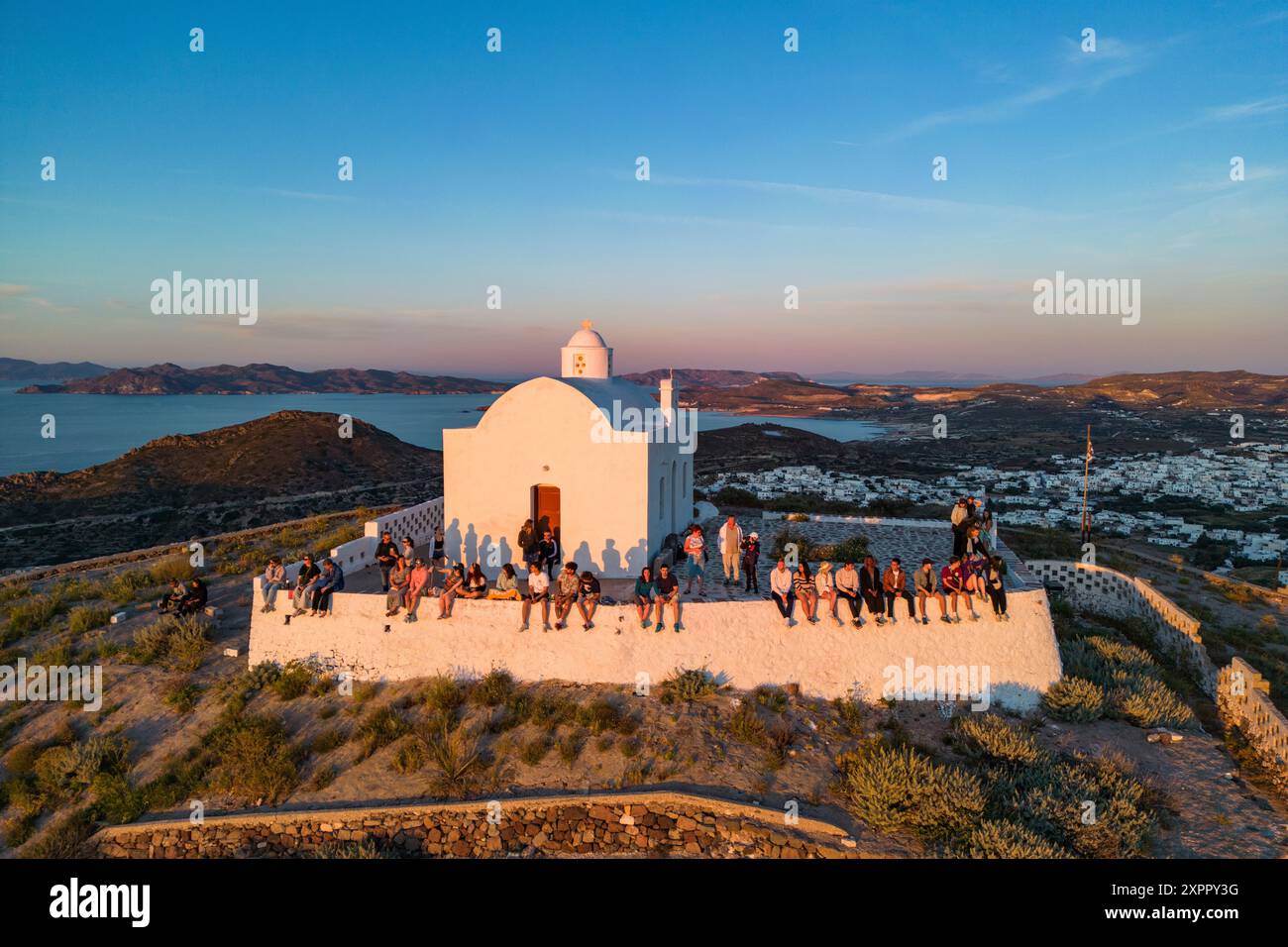 Aerial view of people enjoying the sunset from Panagia Church at Plaka ...