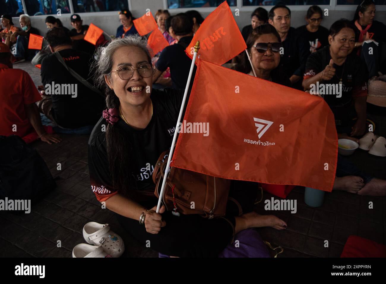Bangkok, Thailand. 07th Aug, 2024. A supporter of the Move Forward Party poses for a photo with ...