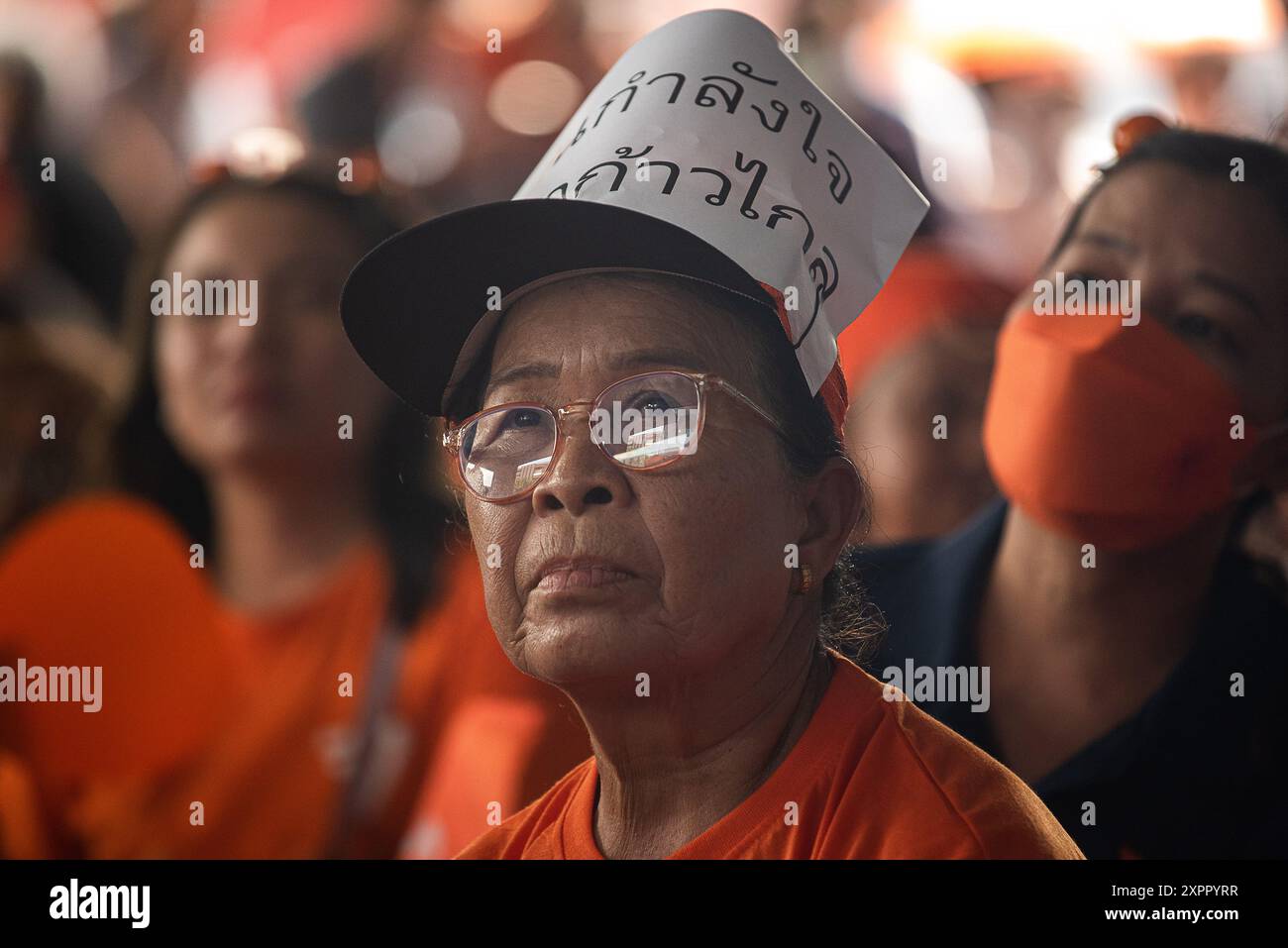 Bangkok, Thailand. 07th Aug, 2024. A supporter of the Move Forward Party seen watching the ...