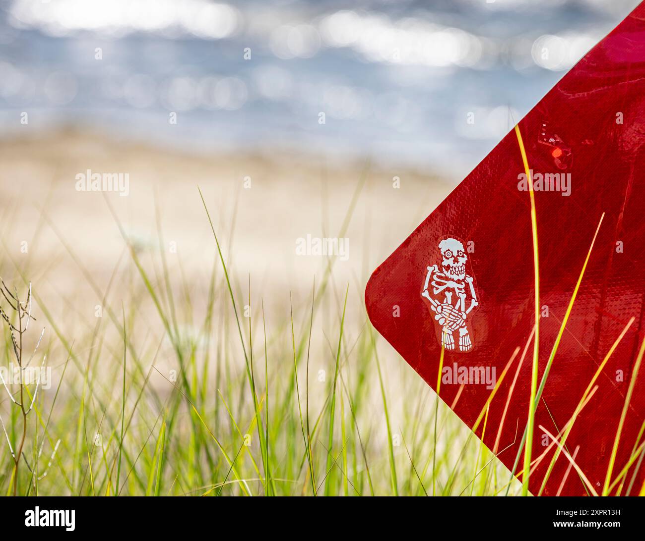 small white skeleton sticker on the edge of a traffic sign Stock Photo ...