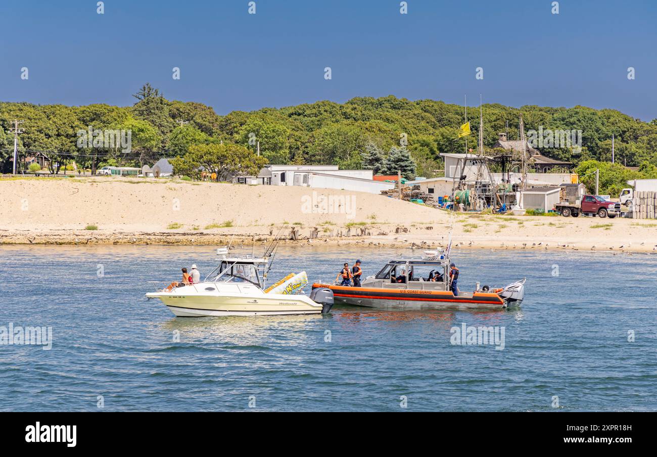small us coast guard boat talking with a recreational boater in montauk ...