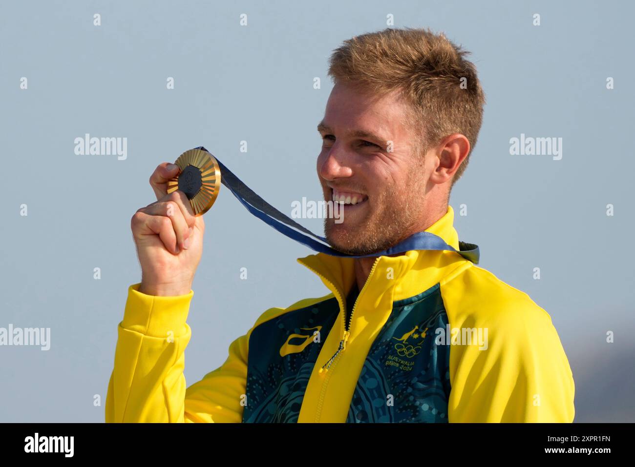 Matthew Wearn of Australia holds his gold medal during a medal ceremony ...