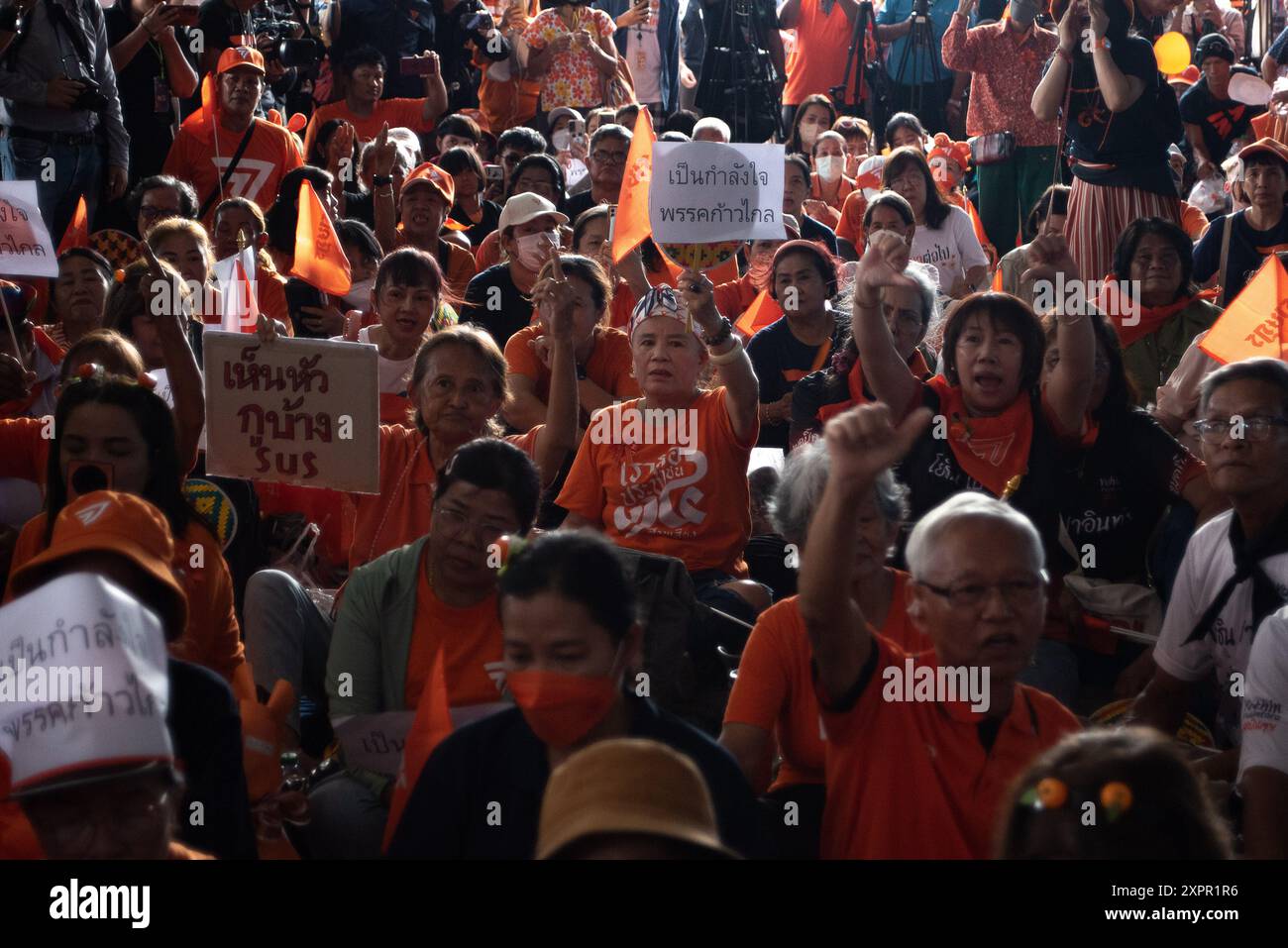 Supporters of the Move Forward Party gather to watch the broadcast of the dissolution case of ...