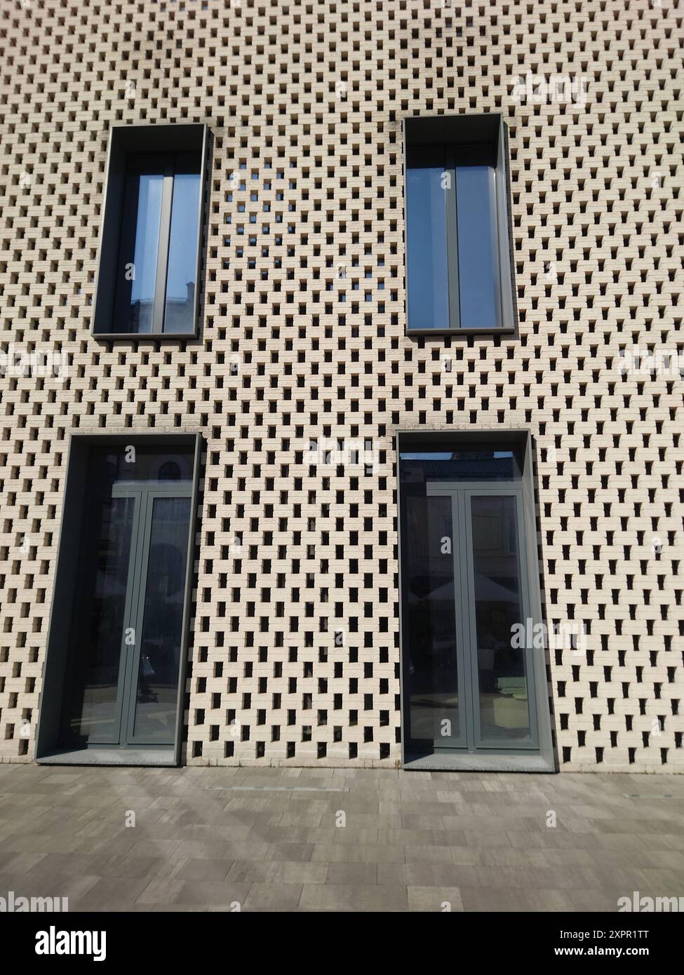 Exterior view of a non-residential building with large windows and ...