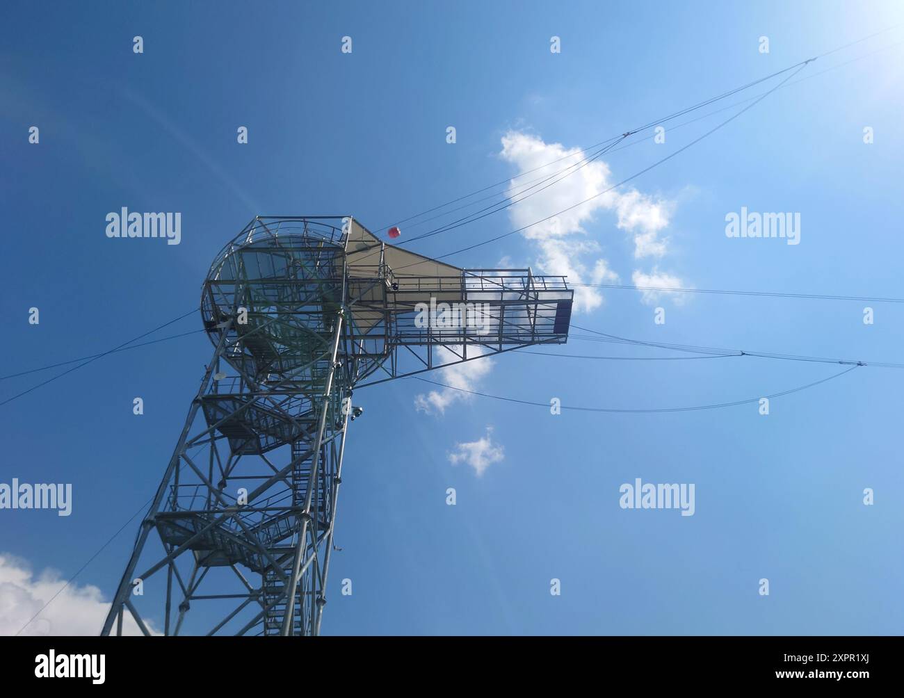 A zipline tower with cables stretched across it Stock Photo - Alamy
