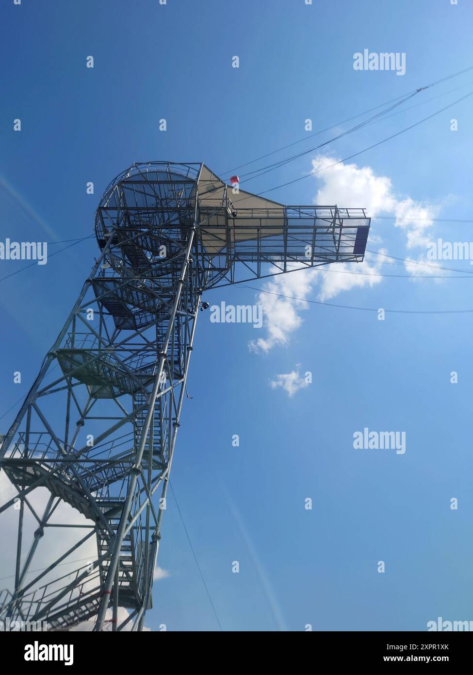 Metal, high-rise structure for zip line, bike line and rope jump attractions Stock Photo - Alamy