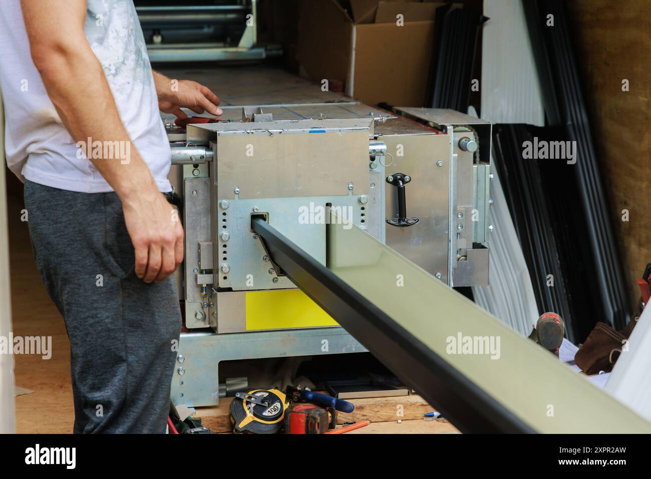 Bending thin metal rain gutters is performed with bending machine Stock ...