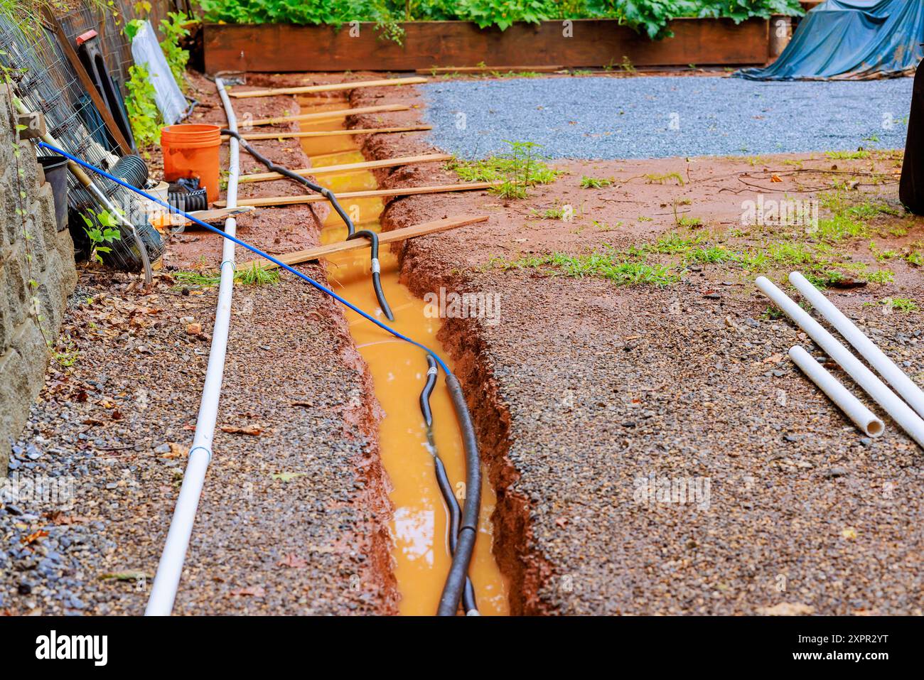 Drainage trench for communication cable floods during heavy rain Stock ...