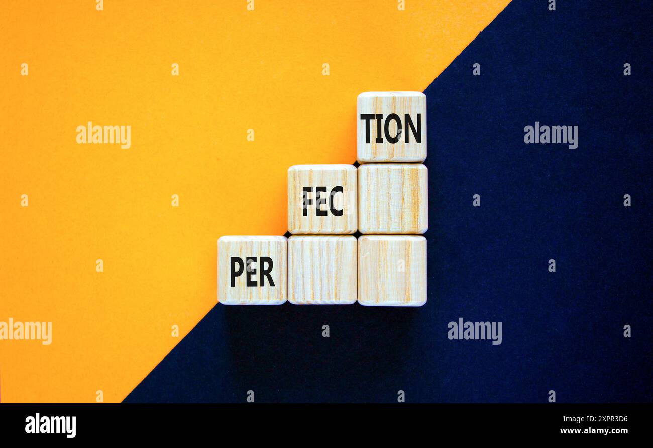 Perfection symbol. Concept word Perfection on beautiful wooden cubes. Beautiful orange black ...