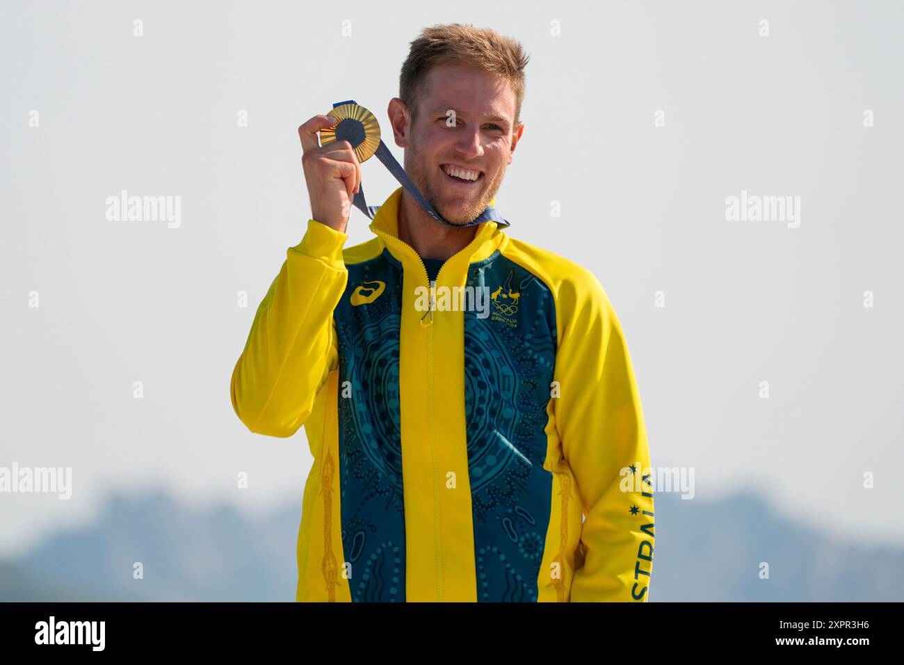 Matthew Wearn of Australia holds his gold medal during a medal ceremony ...