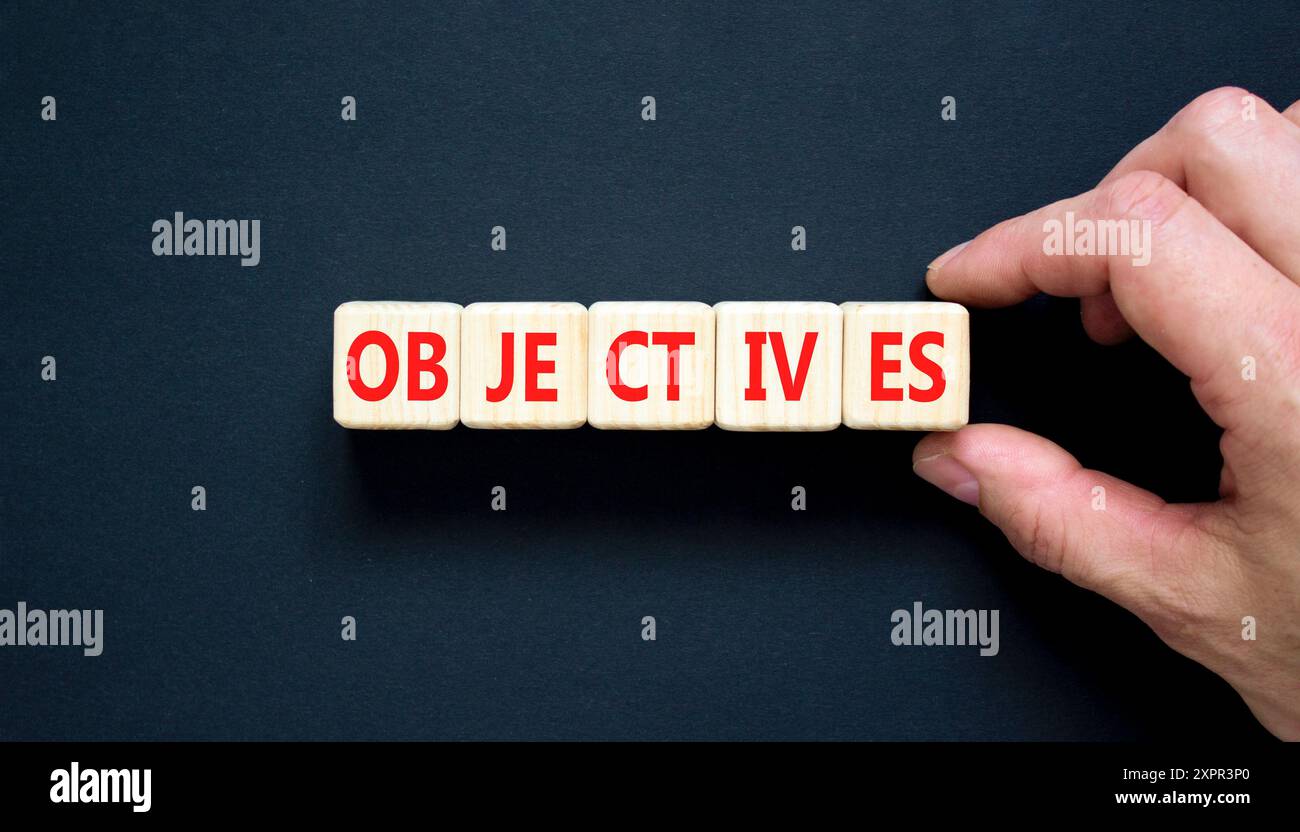 Objectives symbol. Concept word Objectives on beautiful wooden cubes ...
