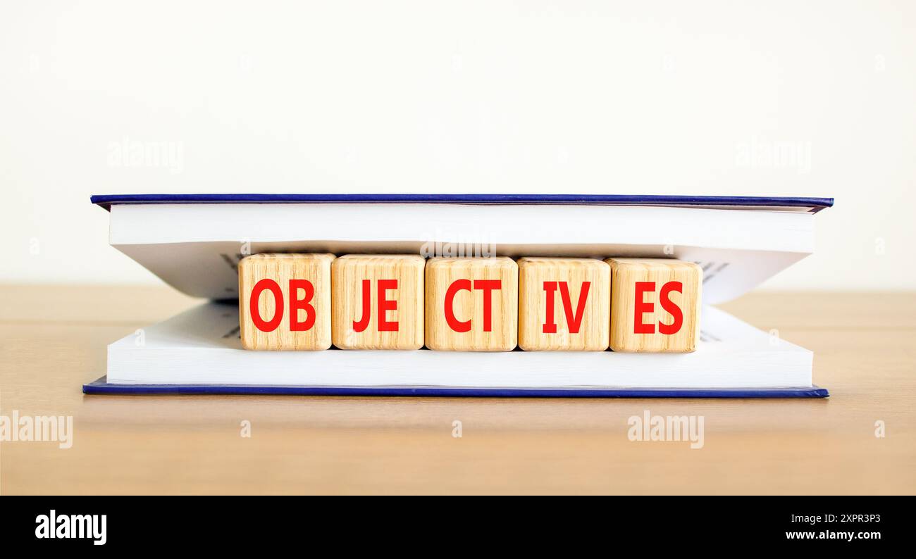 Objectives symbol. Concept word Objectives on beautiful wooden cubes in ...