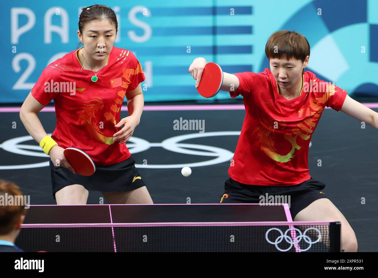 Paris, France. 7th Aug, 2024. Chen Meng (L)/Wang Manyu of China compete ...